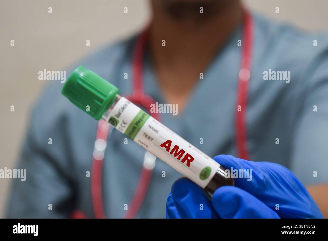 Text AMR - Antimicrobial Resistance test of is written on a bottle ...