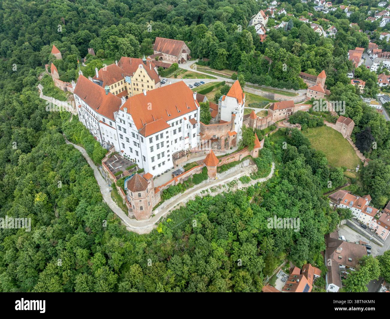 Aerial view of Trausnitz castle with brick curtain walls and towers ...