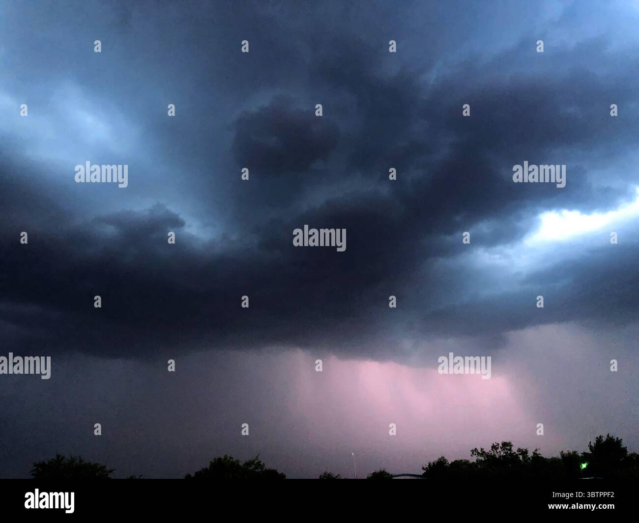 Lightning Glowing in the Rain of a Texas Thunderstorm Stock Photo - Alamy