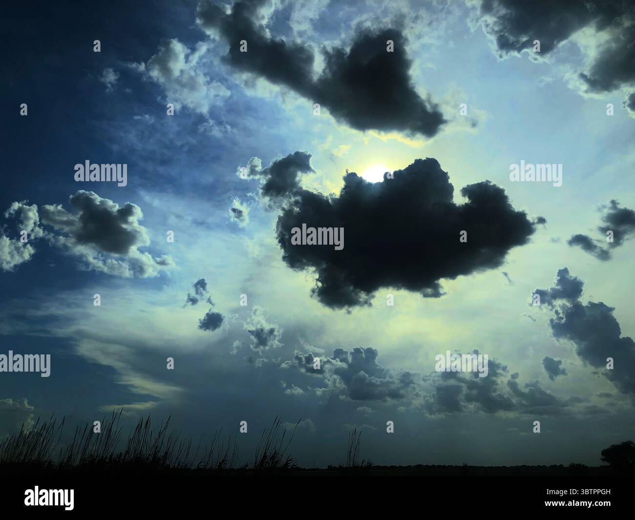 Thunderstorm behind dark clouds in hi-res stock photography and images ...