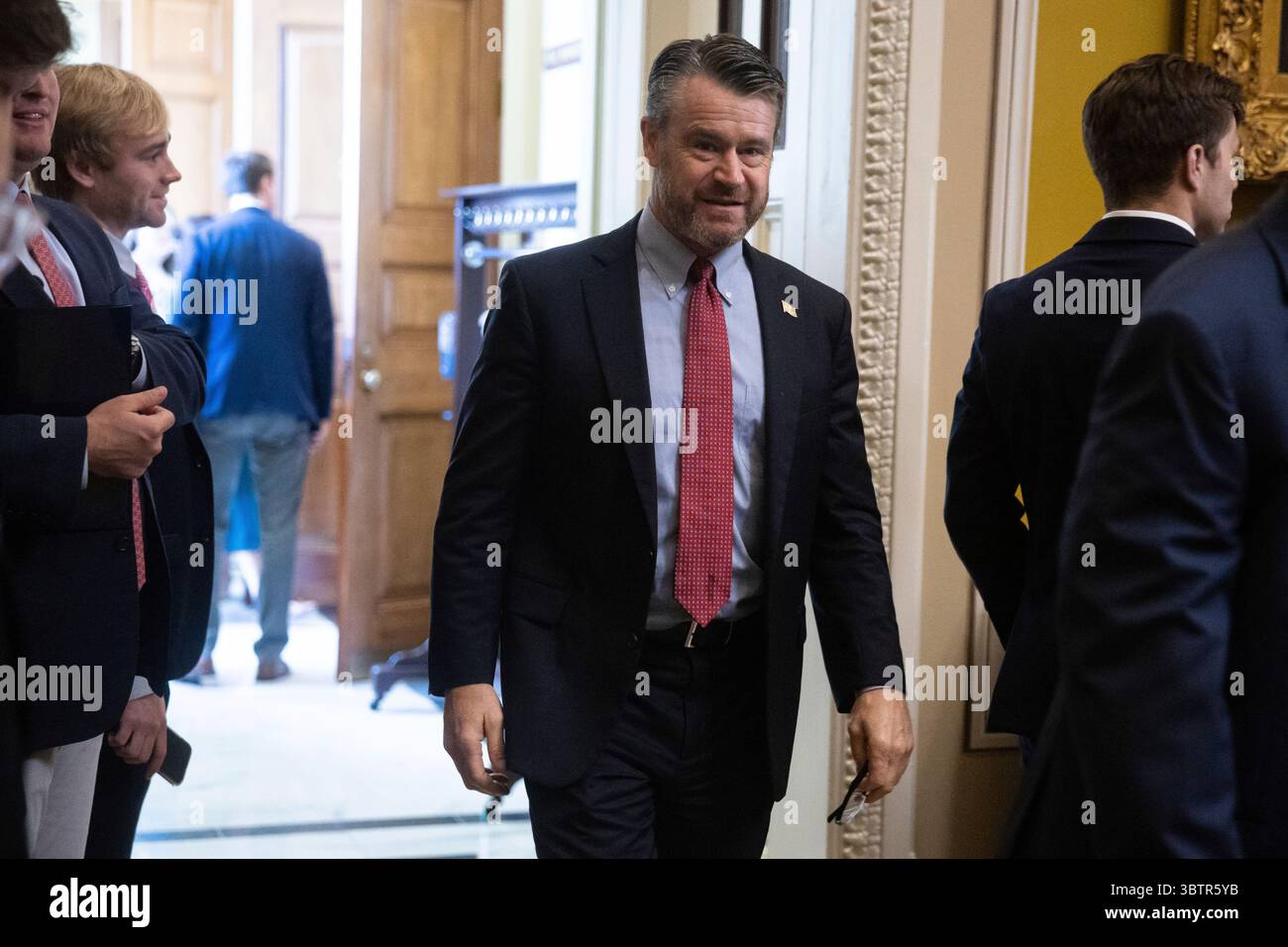 Sen. Todd Young (R-Ind.) departs a Senate Republican Conference luncheon at the U.S. Capitol ...