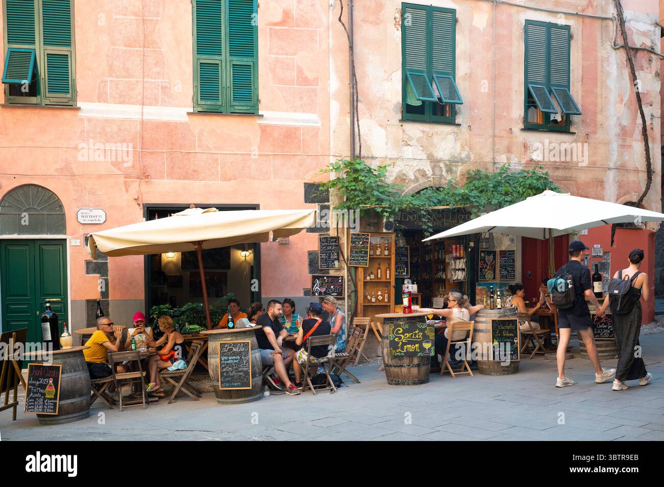 Locals and tourists drinking al fresco at a bar in Monterosso al Mare ...