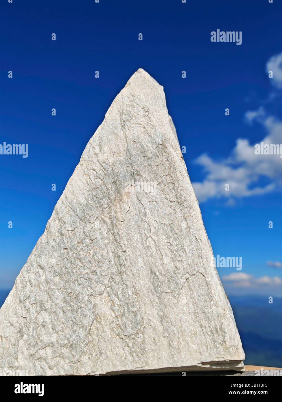 object in the shape of a triangle, pattern and texture on a surface ...