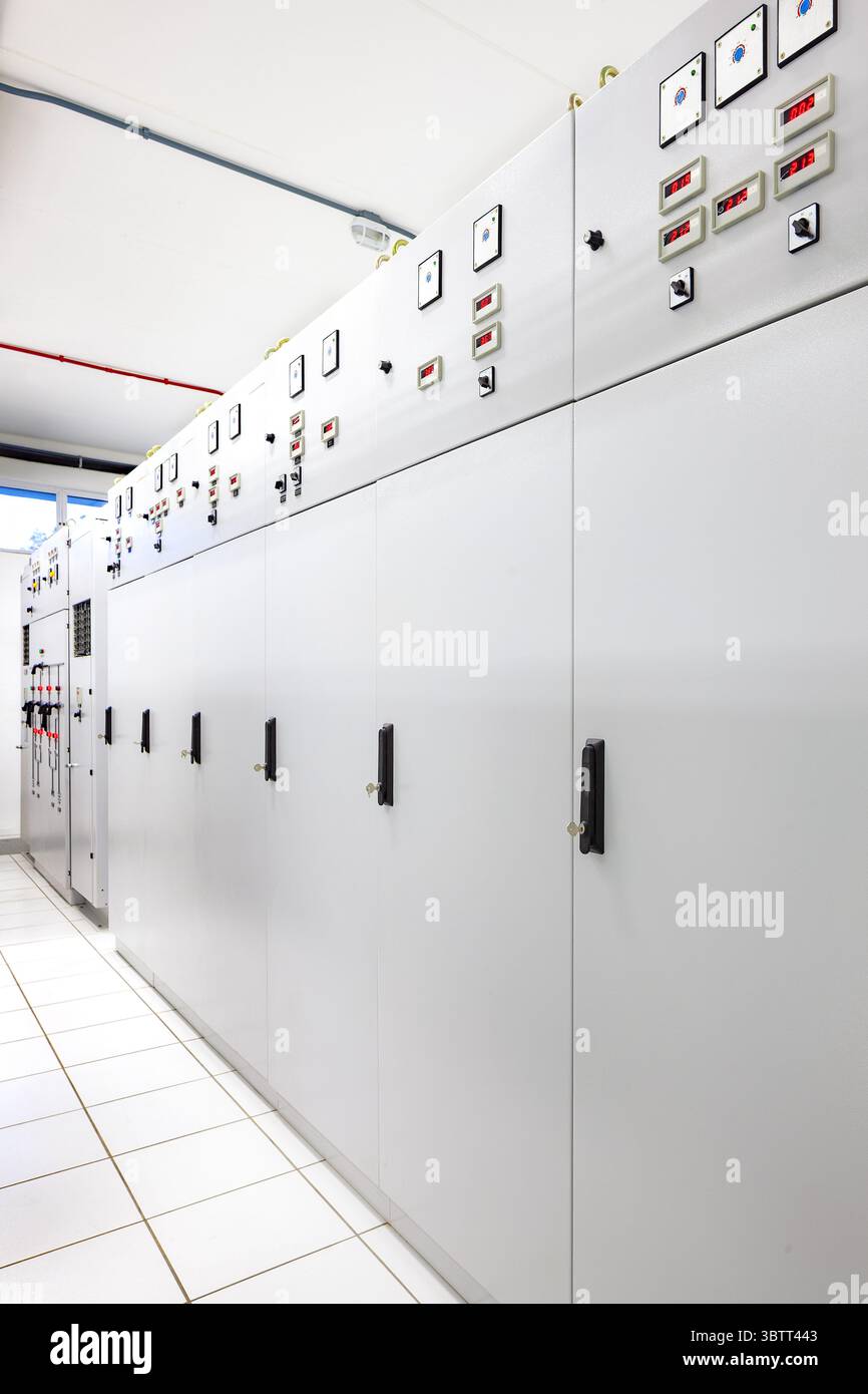 An electrical switchgear room at a substation, showcasing rows of ...