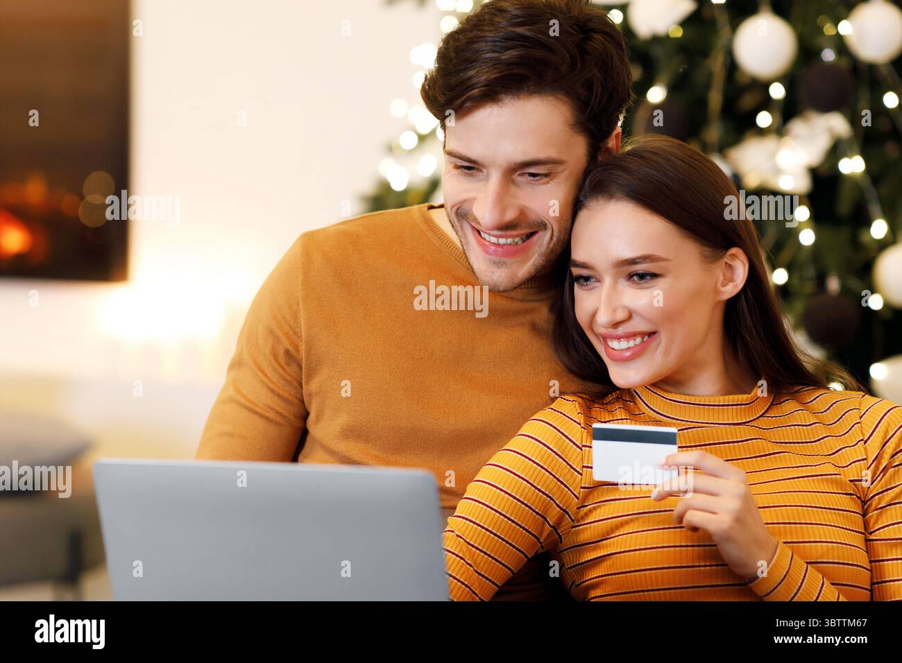 happy couple using pc and debit credit card at home Stock Photo - Alamy