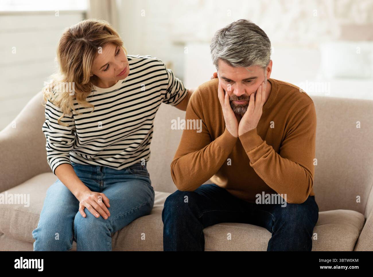 Middle Aged Wife Comforting And Supporting Depressed Husband At Home ...