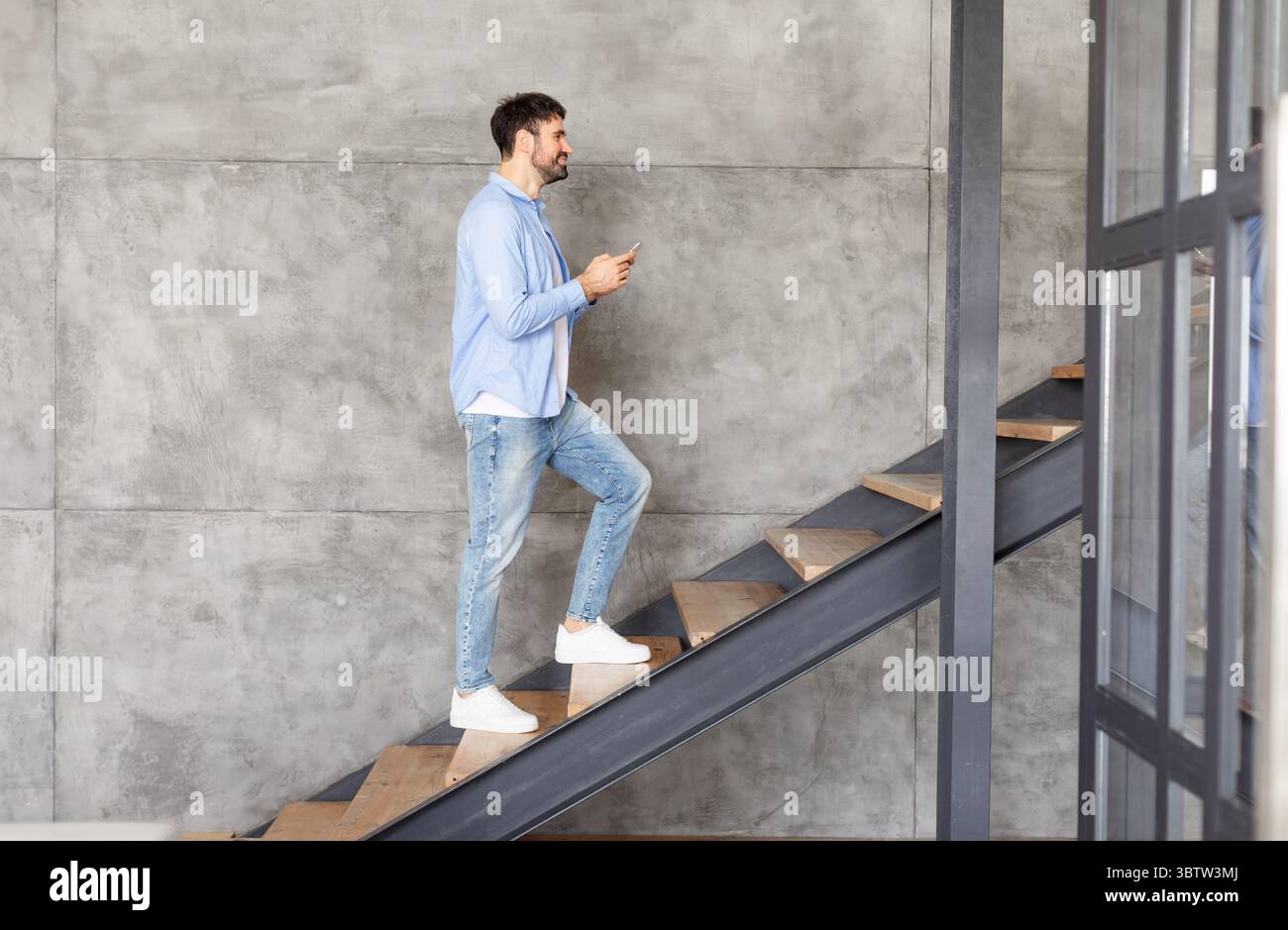 Businessman walking up stairs in hi-res stock photography and images ...