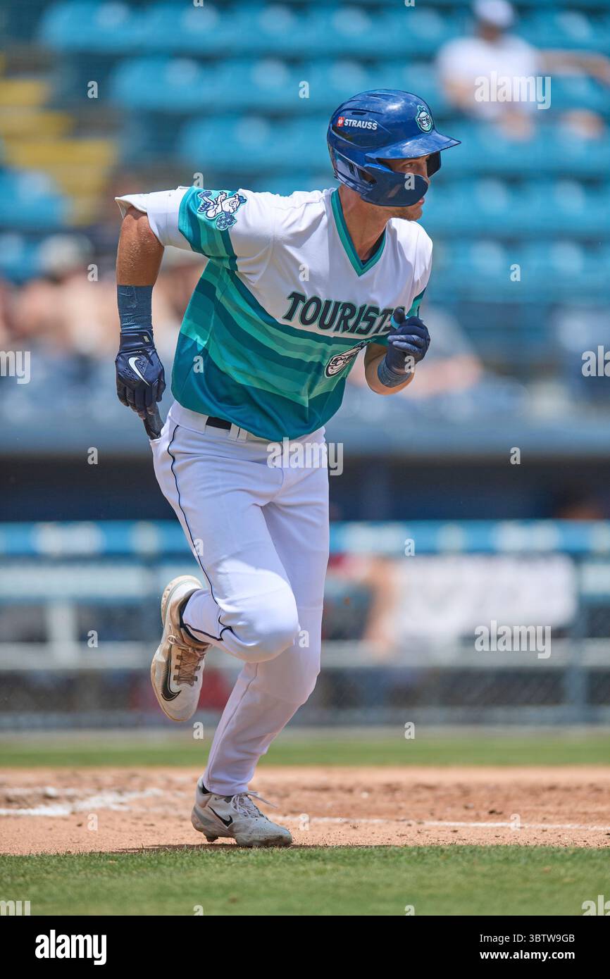 Asheville Tourists Drew Brutcher (18) runs to first base during a game ...