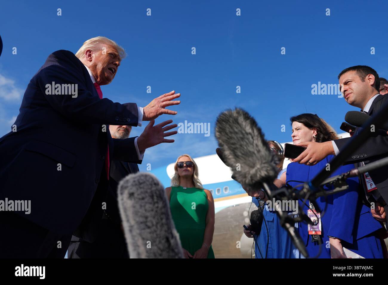 President Donald Trump speaks to the media after arriving at Joint Base ...