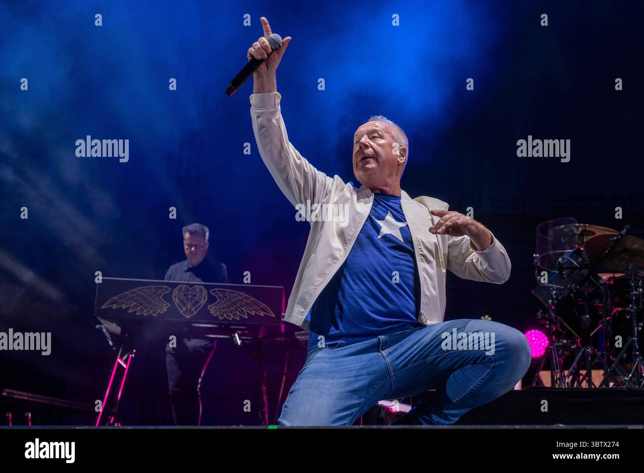 Jim Kerr, lead vocal of Simple Minds on stage during their live concert ...