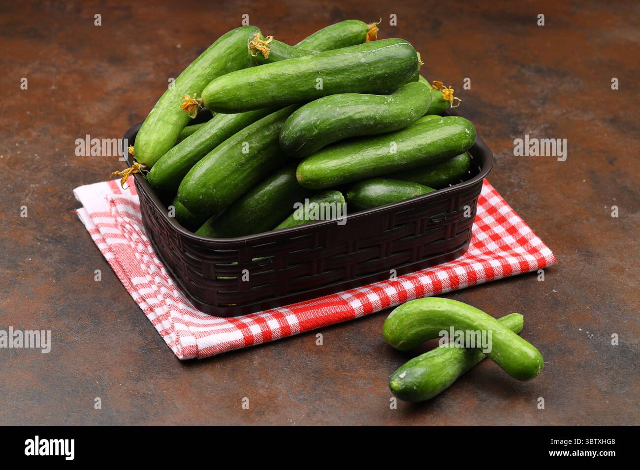 Fresh green cucumbers in a small wooden vegetable crate Stock Photo - Alamy