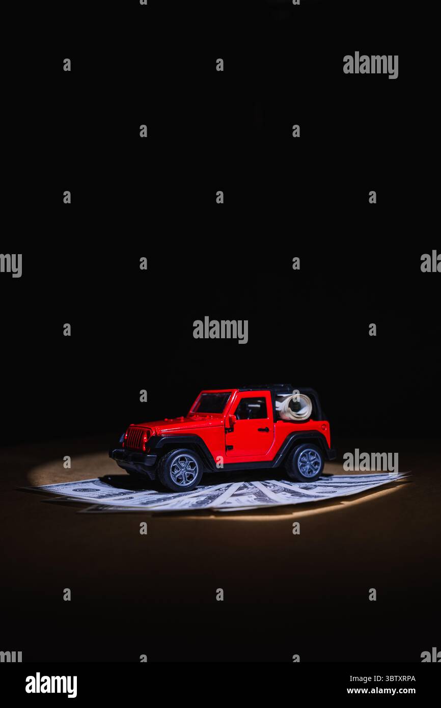 Red 4x4 pickup truck on hundred dollar bills saved to buy the car with ...