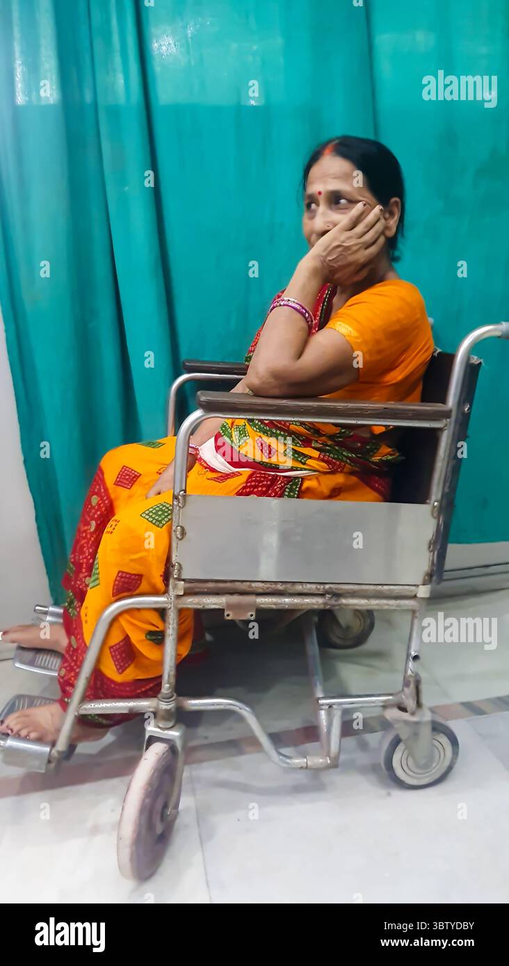 wheelchair patient in emotional distress at hospital at indoor Stock ...