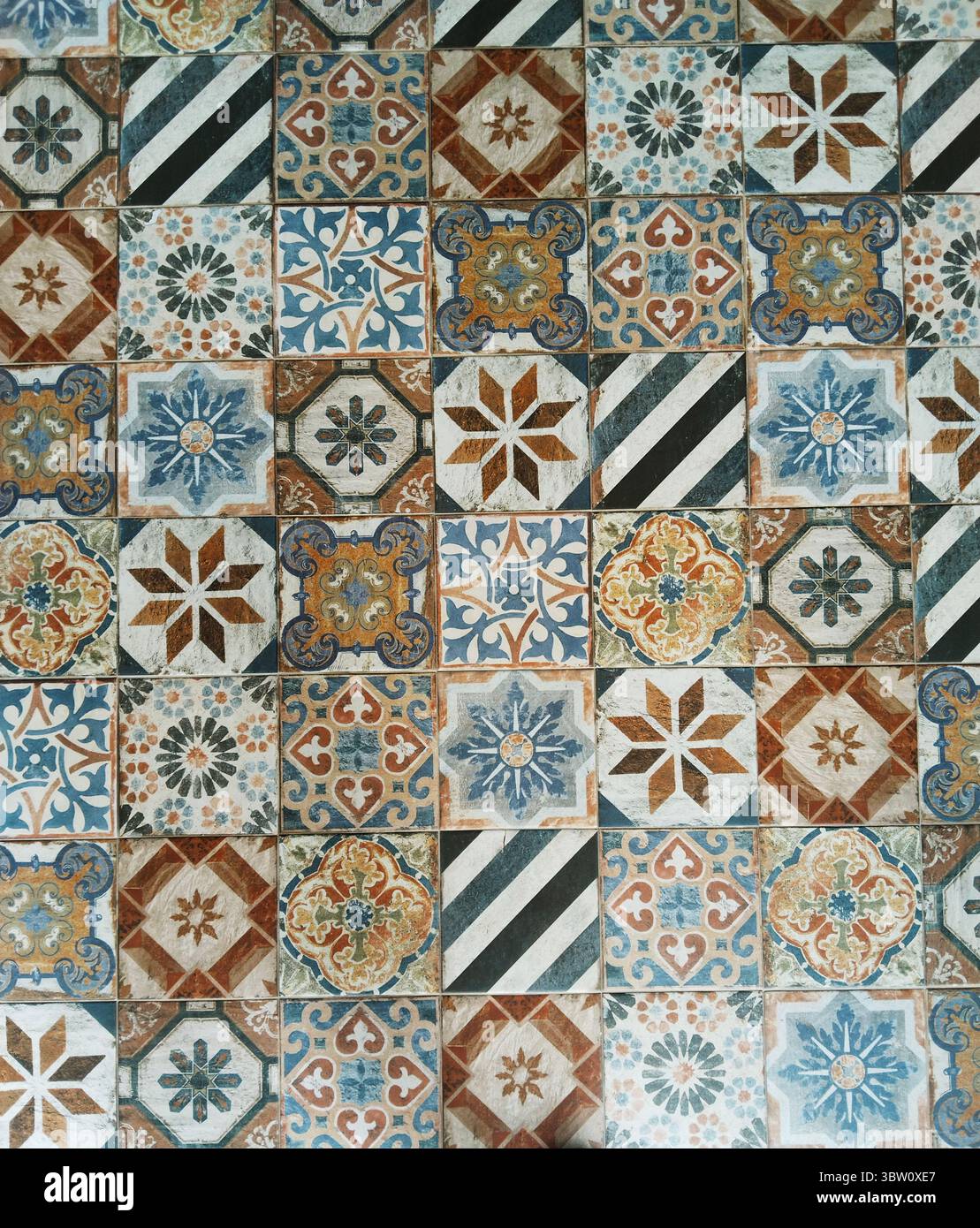 Various vintage tile patterns are laid together in a chic and colorful ...