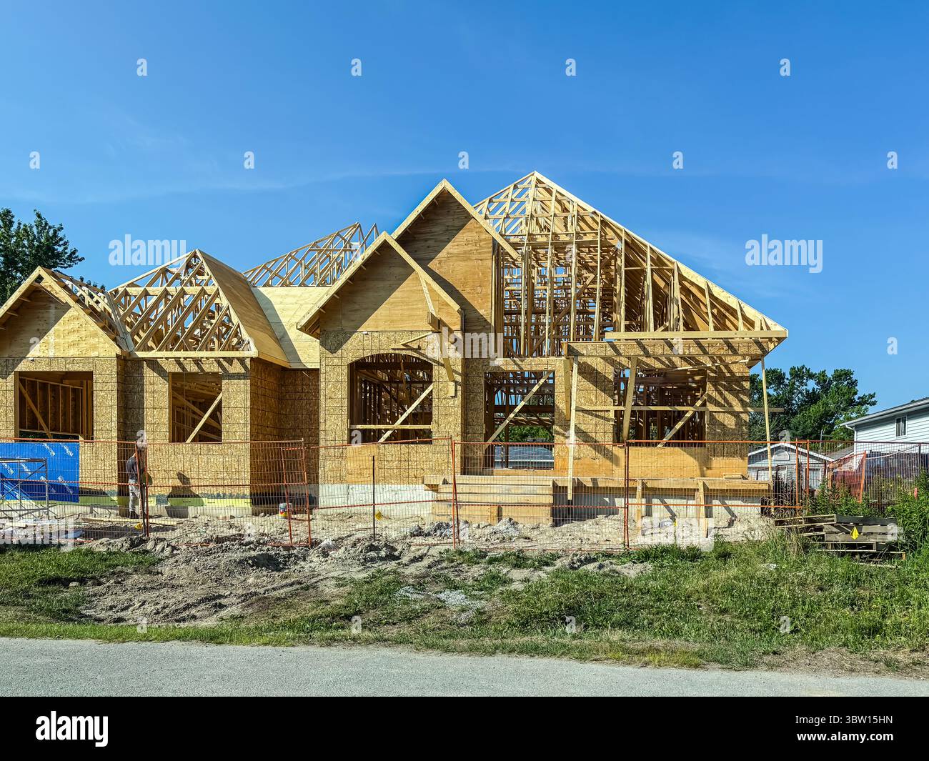 Residential house under construction framed with wood sheathing and ...