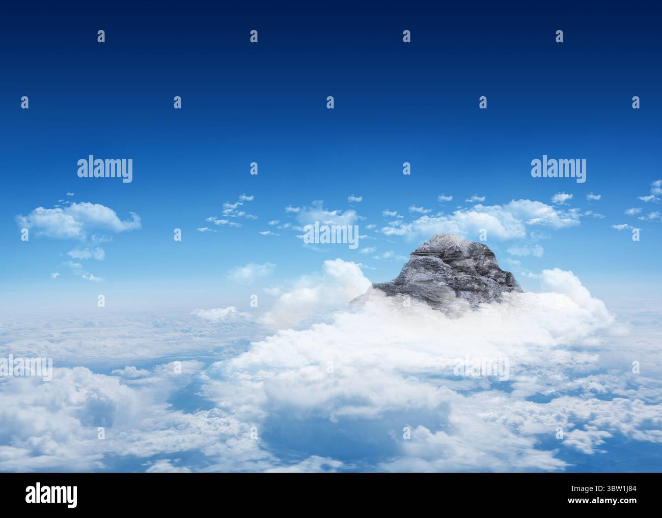 Mountain peak through clouds Stock Photo - Alamy
