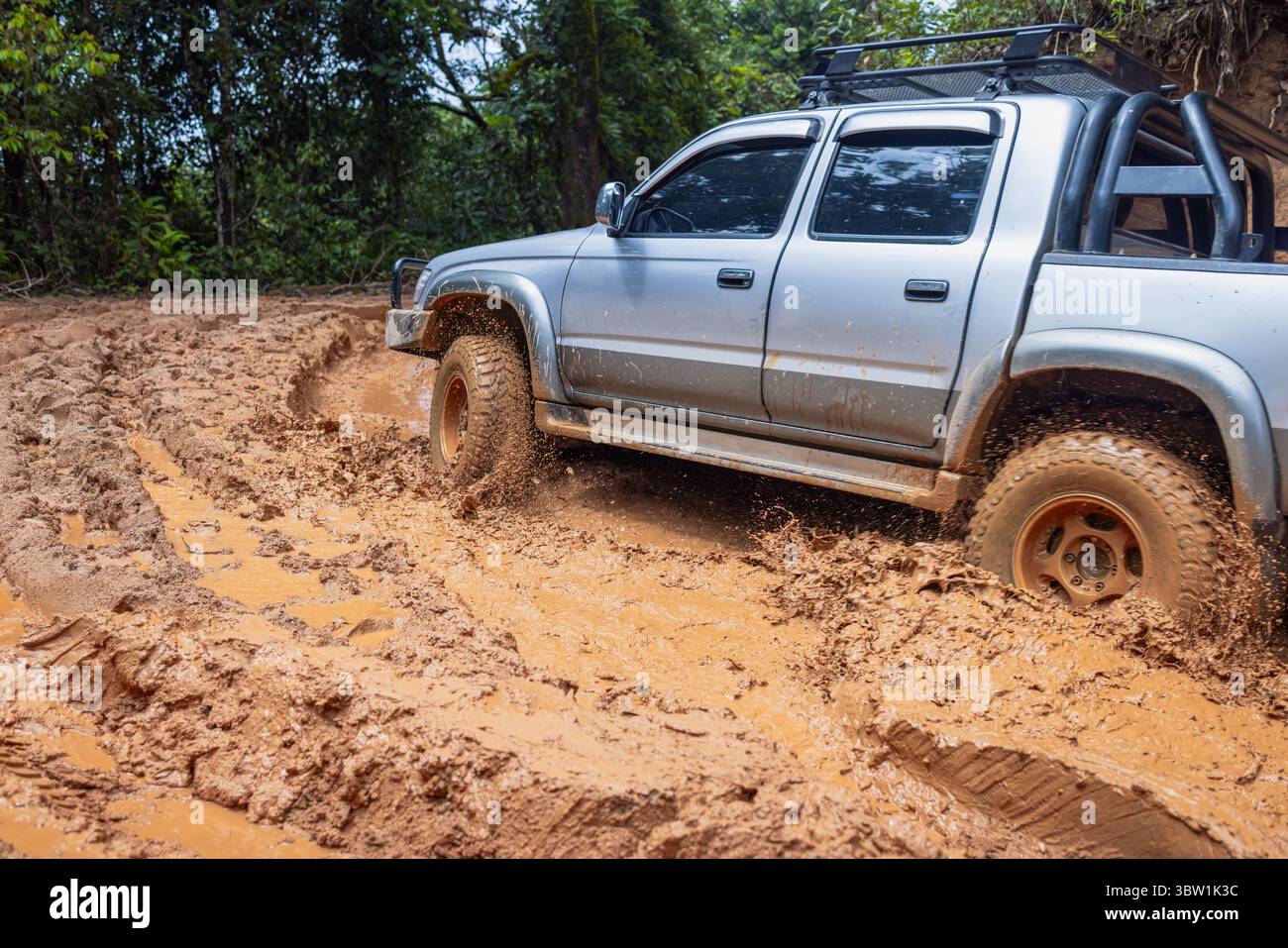 Off road car. Offroad car on bad road. Mud and water splash in offroad ...
