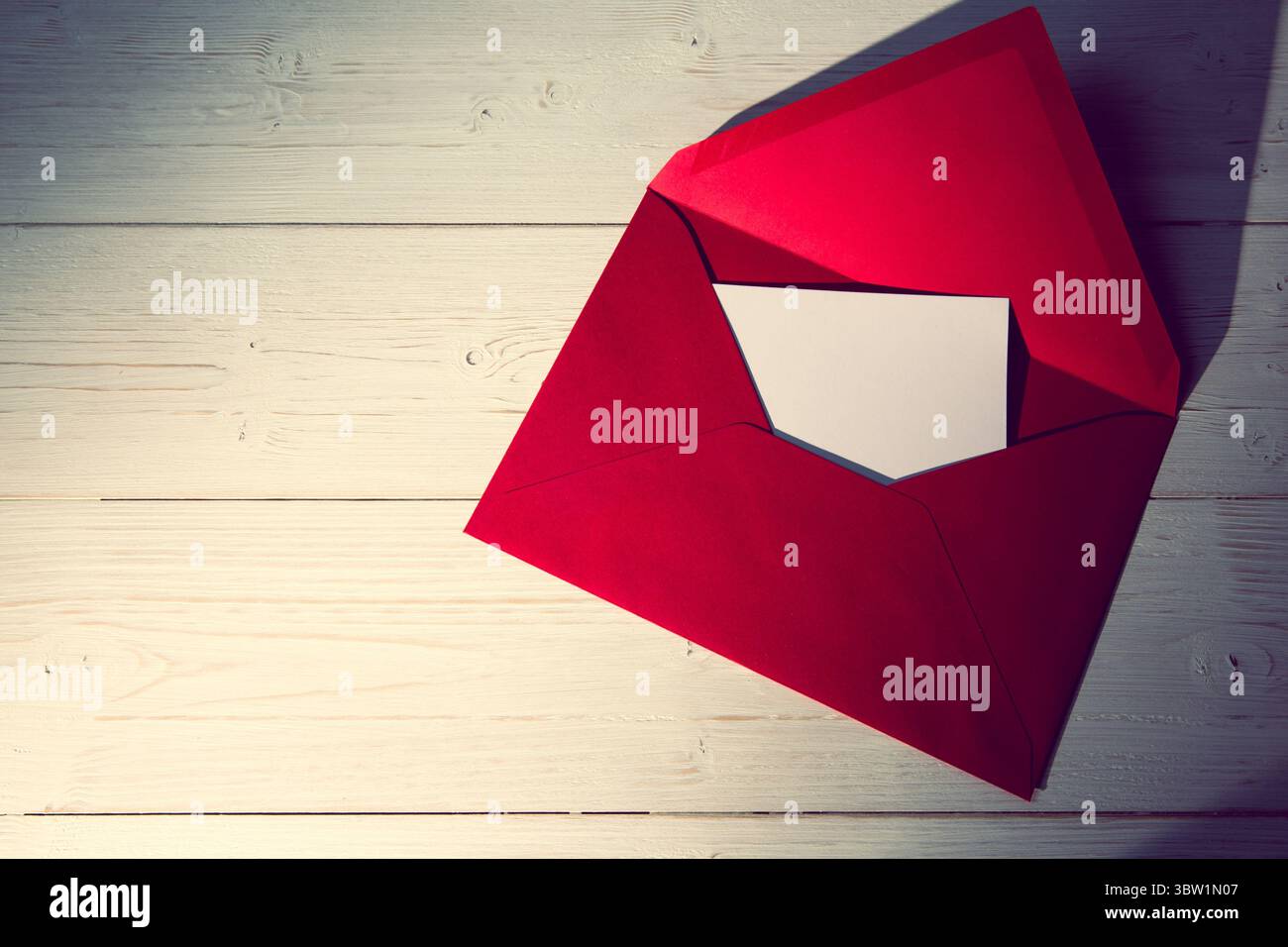 Digital image of red envelope with paper Stock Photo - Alamy