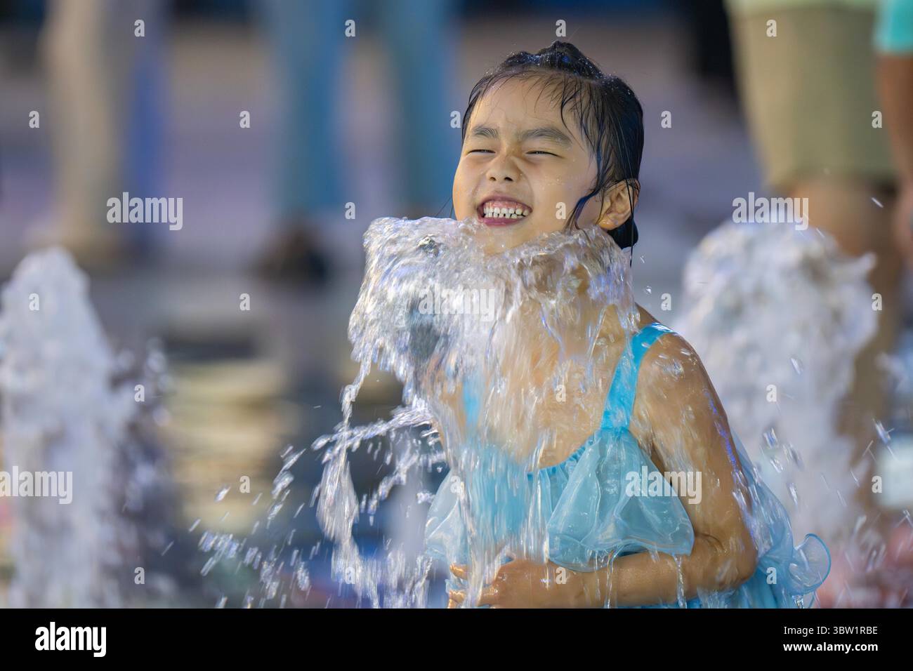 Children play with water in Chongqing, China, 12 July, 2025. (Photo by ...