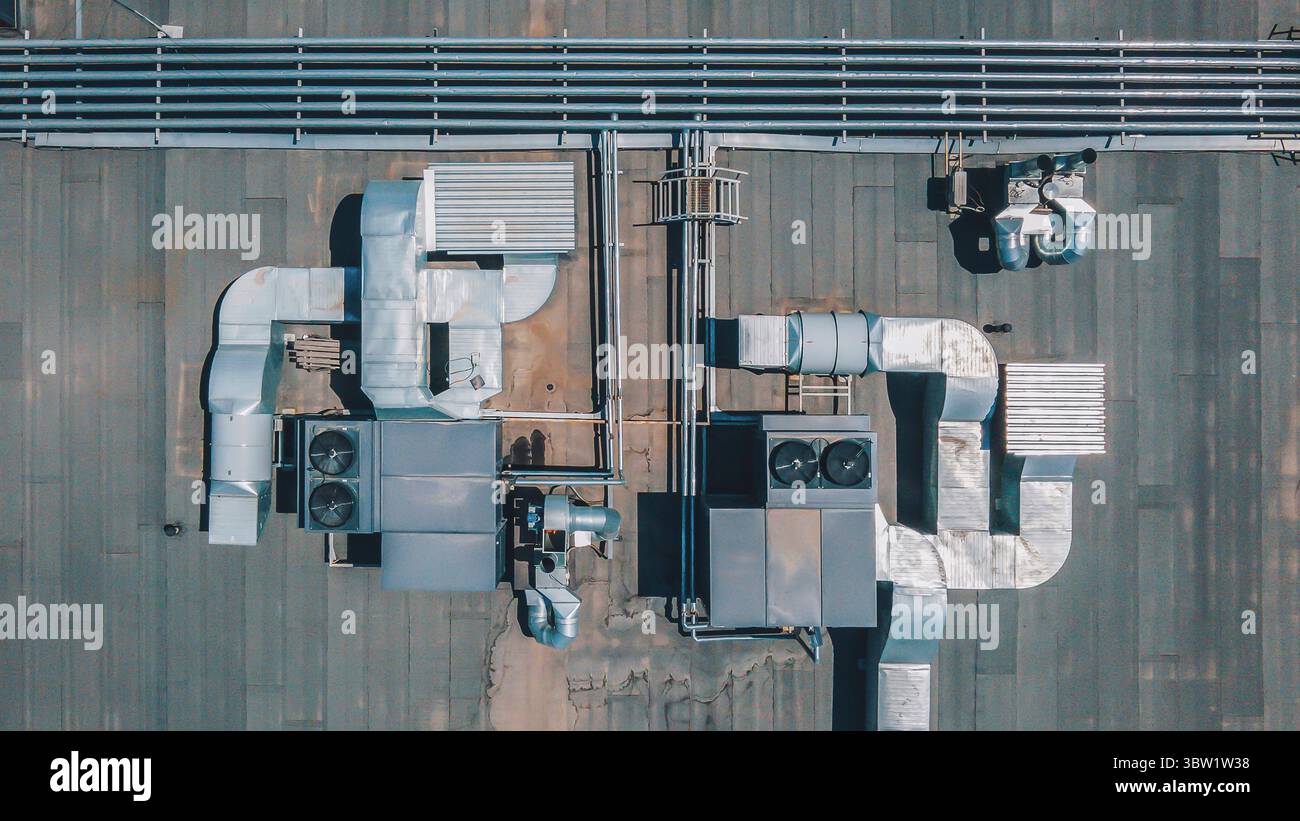 Chillers with air ducts on the roof of the building. Climate control ...