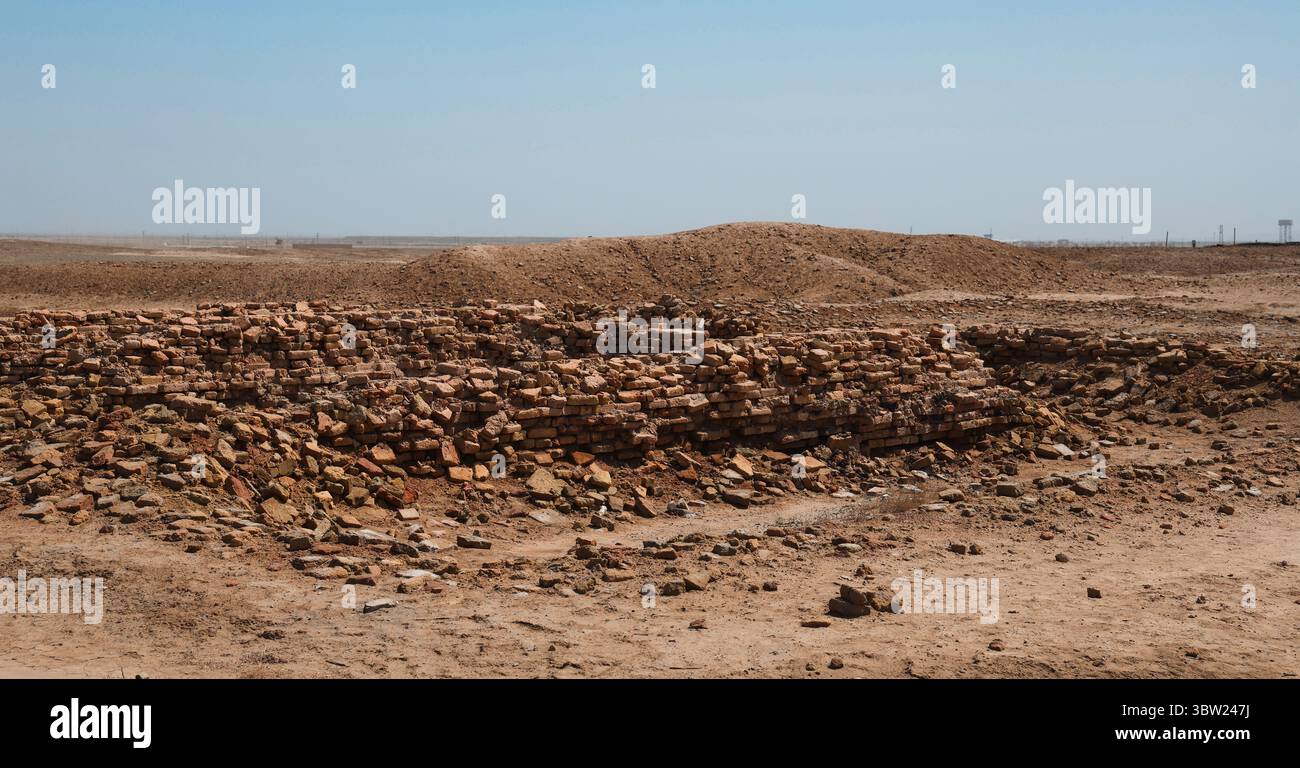 Ruins of the ziggurat of Ur rise from the barren landscape in Iraq ...