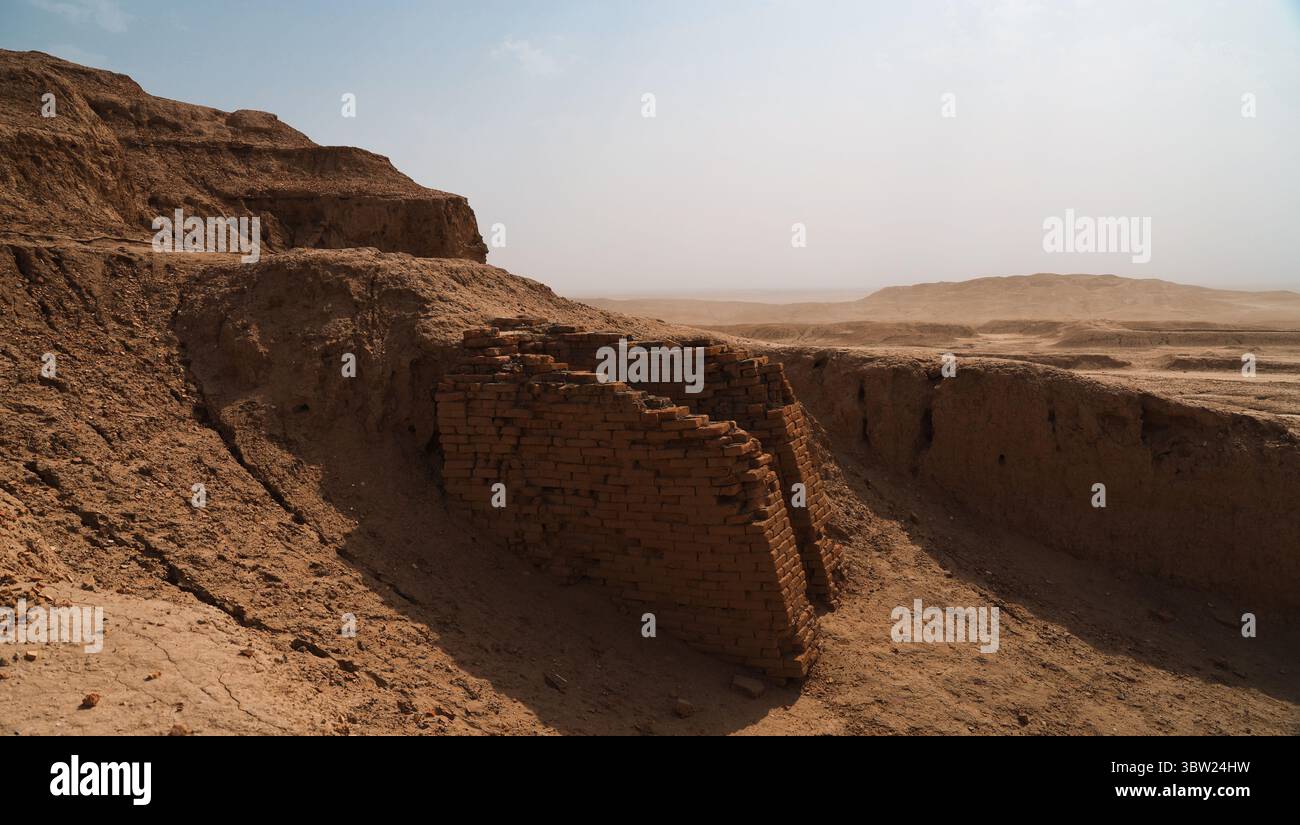 Ruins of Uruk showcase ancient brick structures amid a barren landscape ...