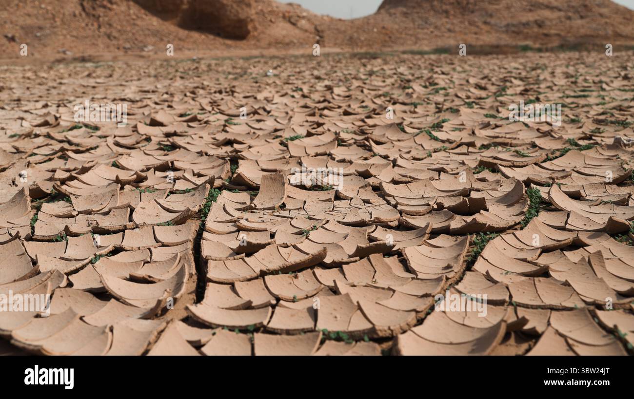 Dried and cracked earth in Uruk Iraq highlights the severe drought ...