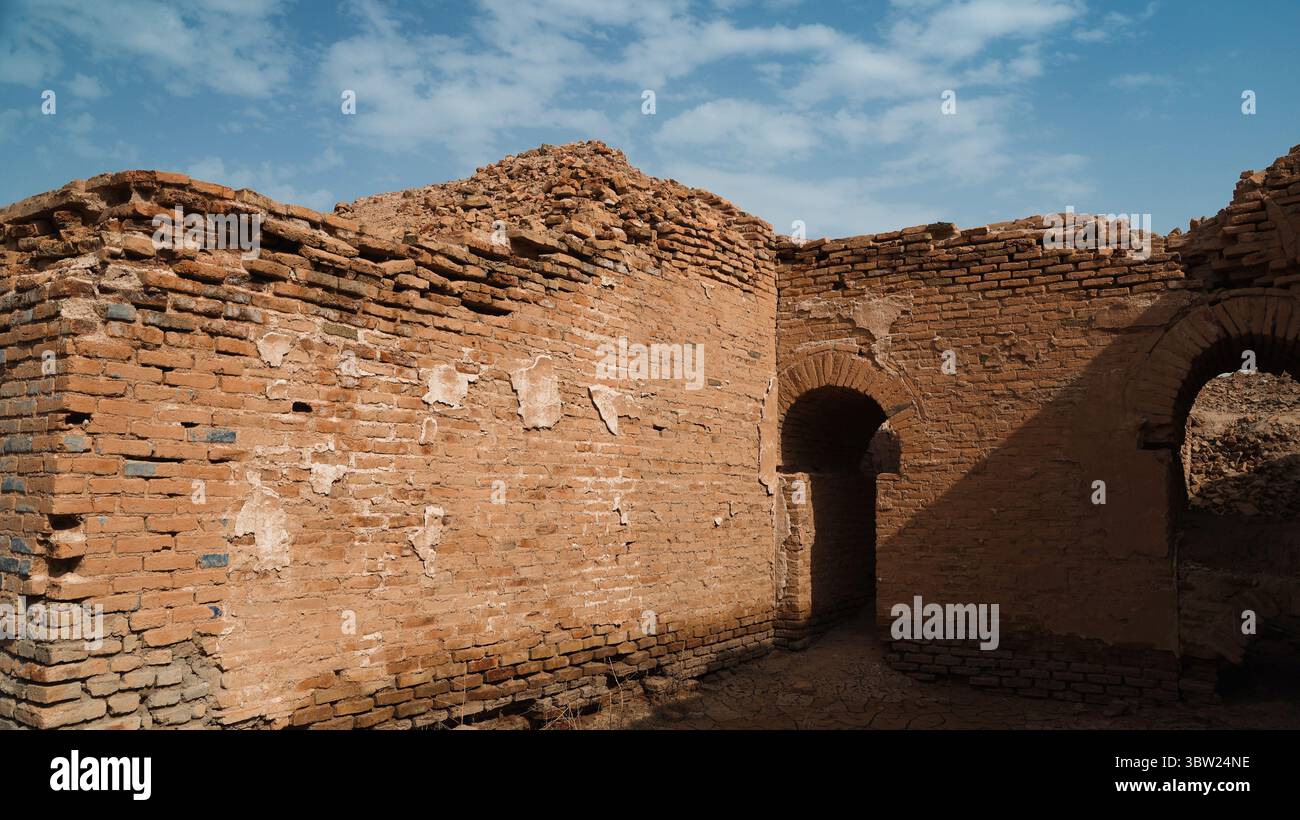 Ruins in Uruk Iraq display ancient brick walls and archways under a ...