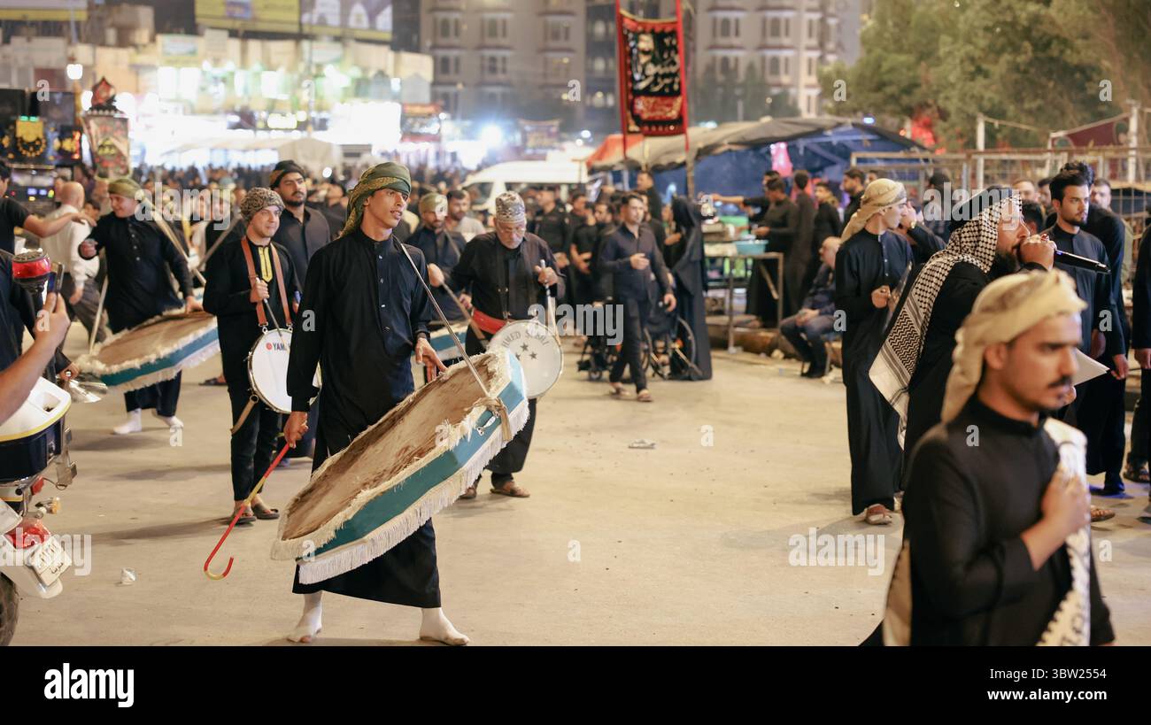 Crowds gather in An Najaf, Iraq, to honor Ashura, with traditional ...