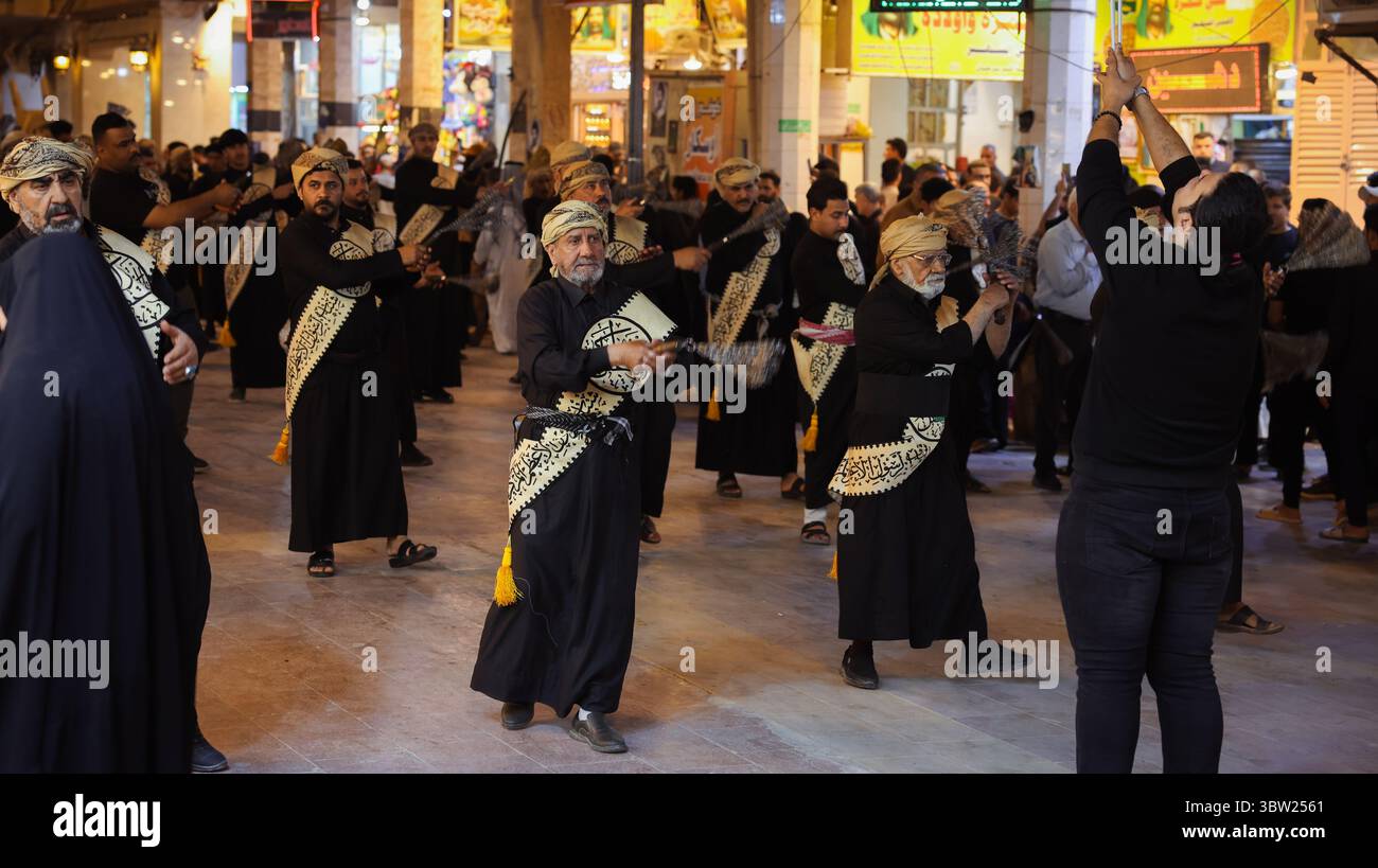 Traditional entertainers in black attire engage in a vibrant ...
