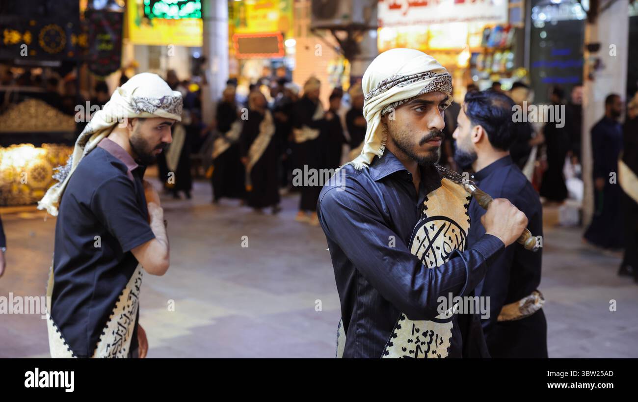 Men dressed in traditional attire engage in mourning rituals during ...