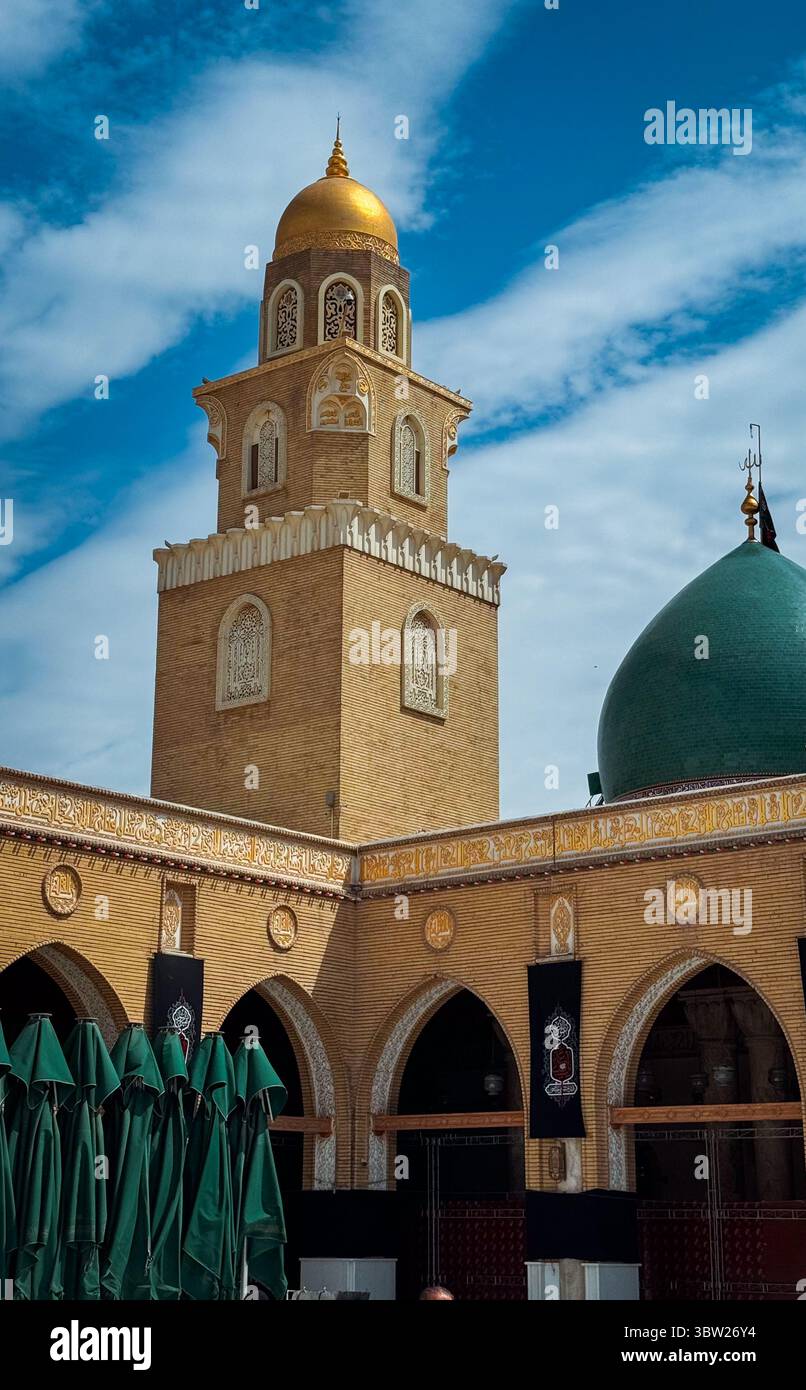 Majestic mosque architecture stands in Kufa Iraq with a golden dome and ...