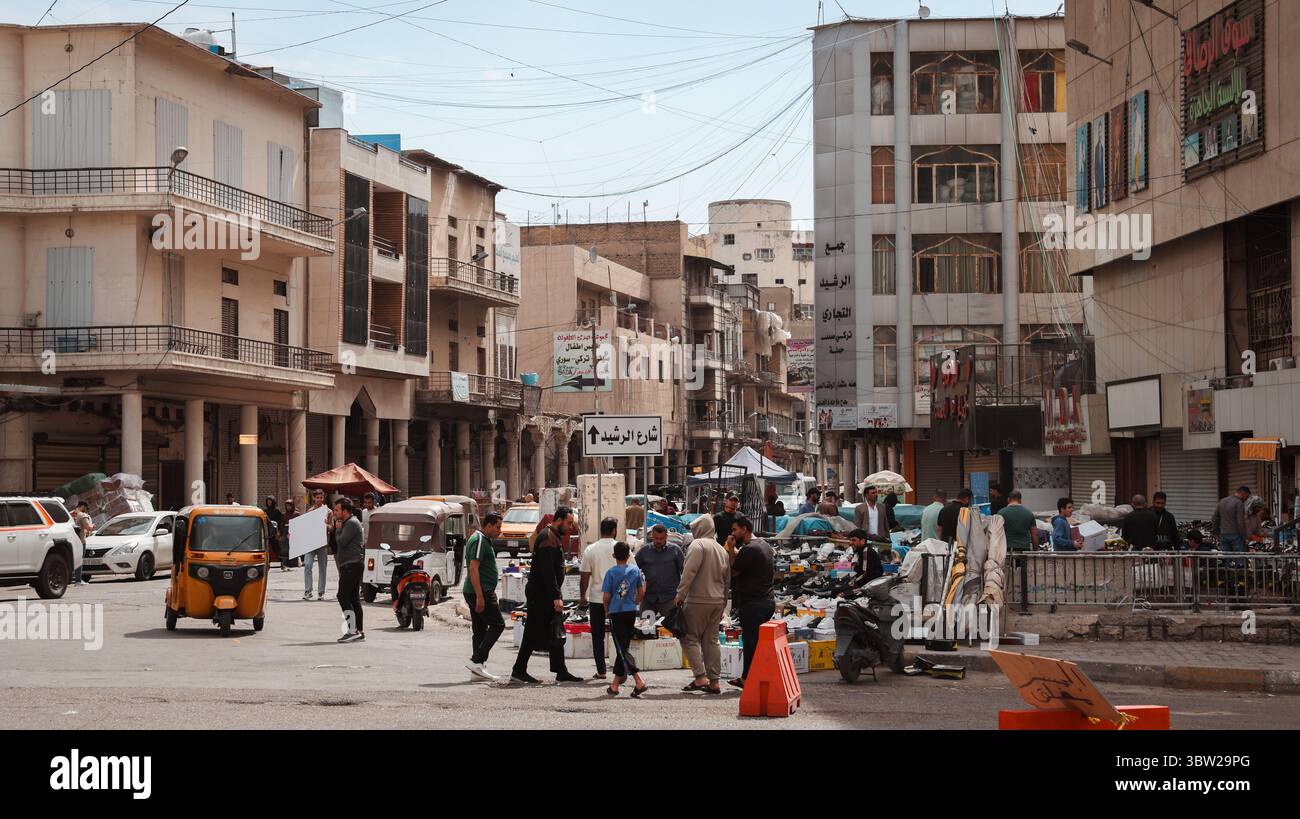 Vibrant market scene in Baghdad showcasing vendors, shoppers, and local ...