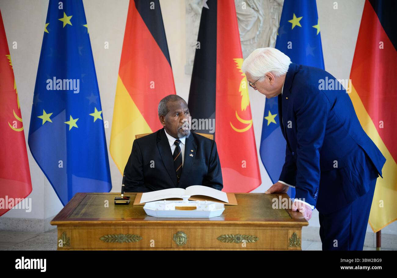 16 July 2025, Berlin: Robert Dadae (l), Governor General of Papua New ...