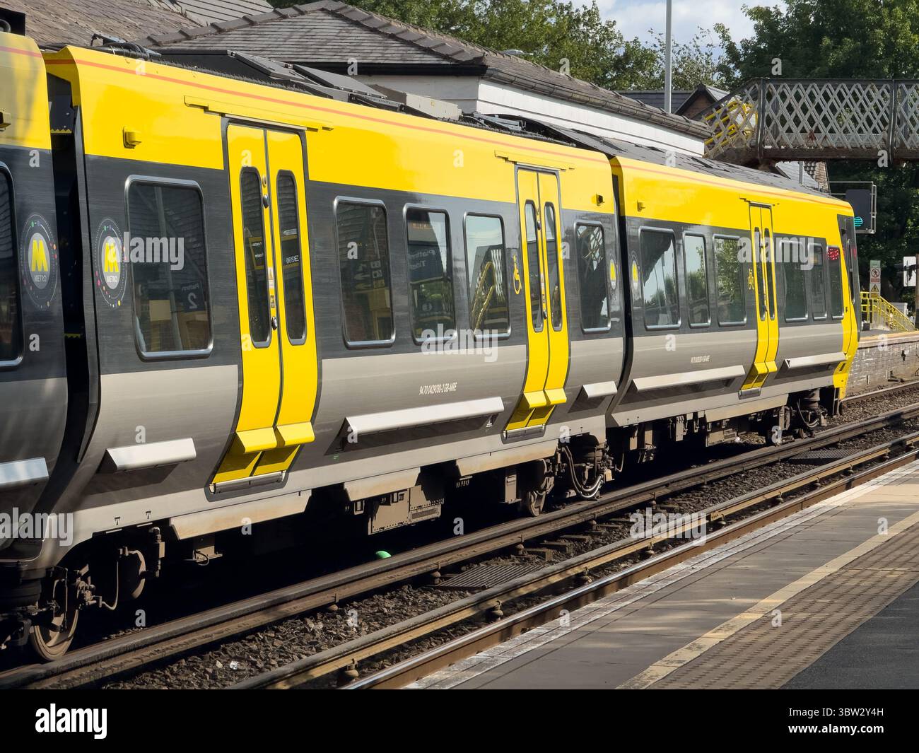 A new train Class 777 for Merseyrail service arrives at Maghull Station ...