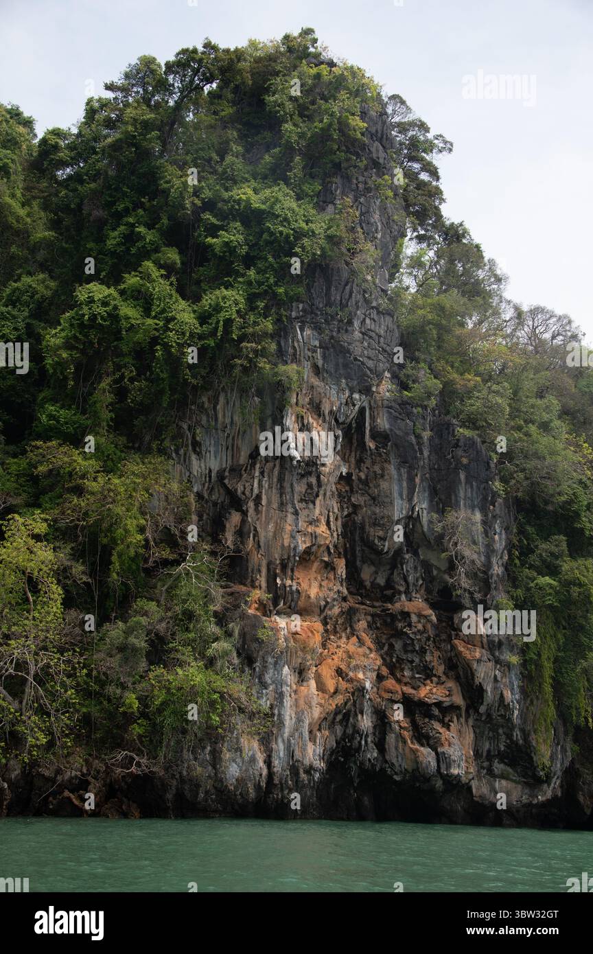 Vibrant colours seen on limestone cliffs on a small, uninhabited island ...
