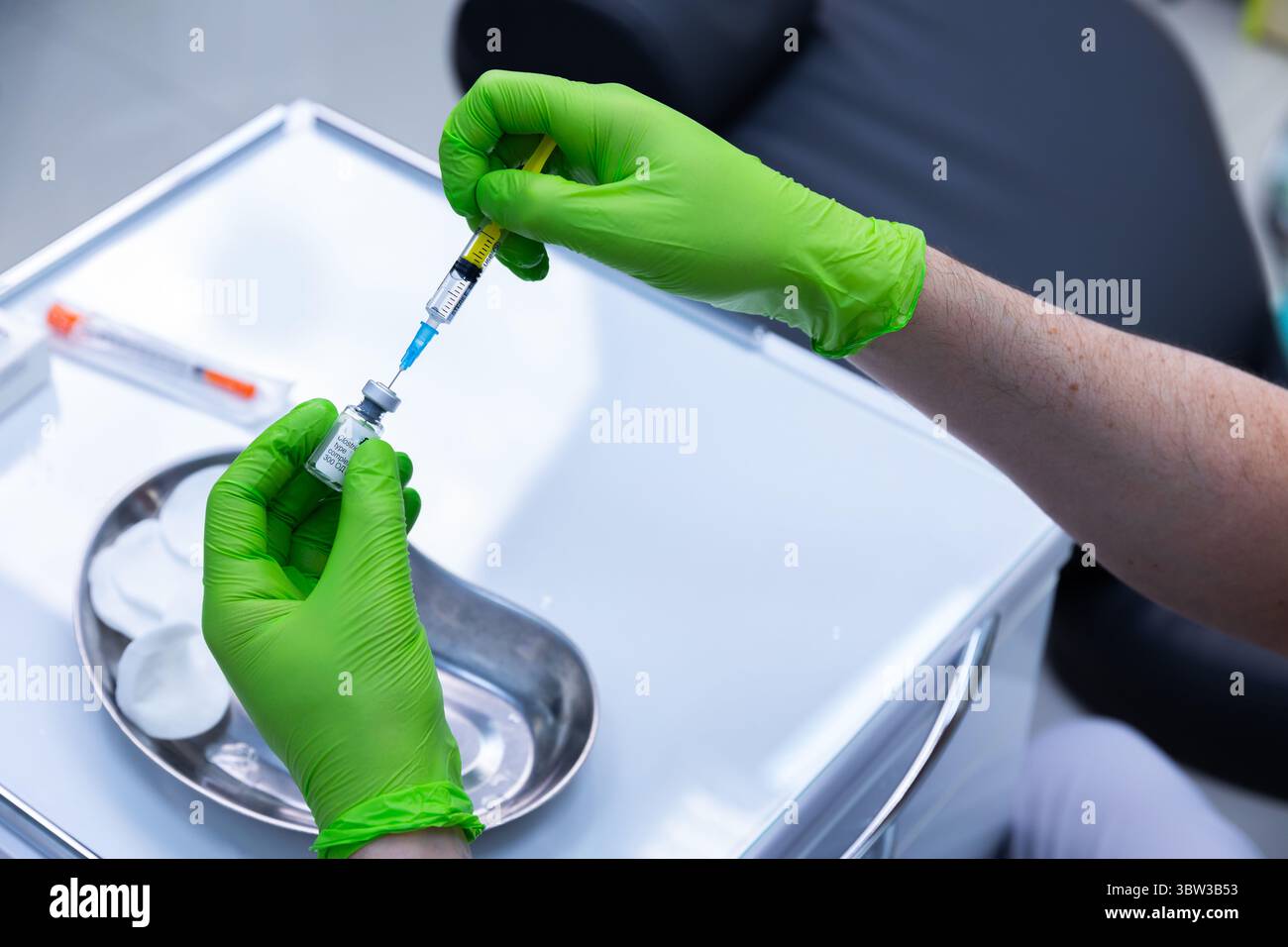 Healthcare Professional Preparing Vaccine with Syringe in Clinical ...