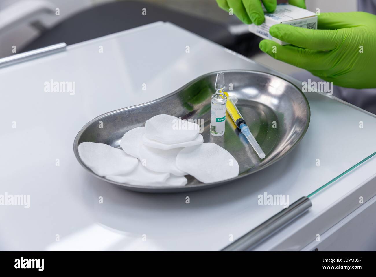 Prepared Medical Tray with Cotton Pads, Syringe, and Vial in a Clinical ...