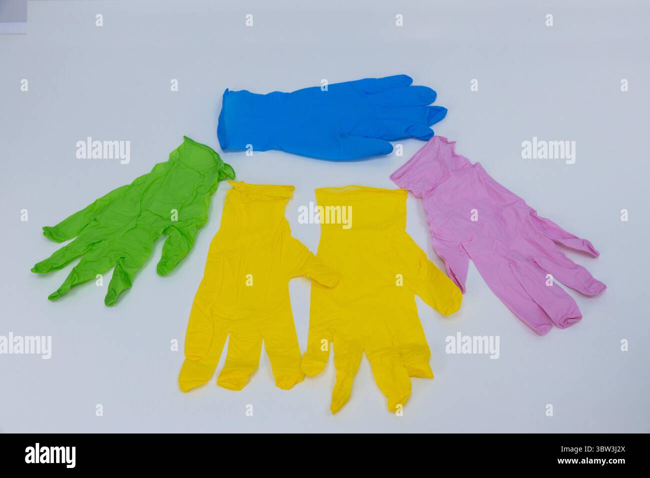 A Vibrant Collection of Colorful Rubber Gloves Arranged Neatly on a ...