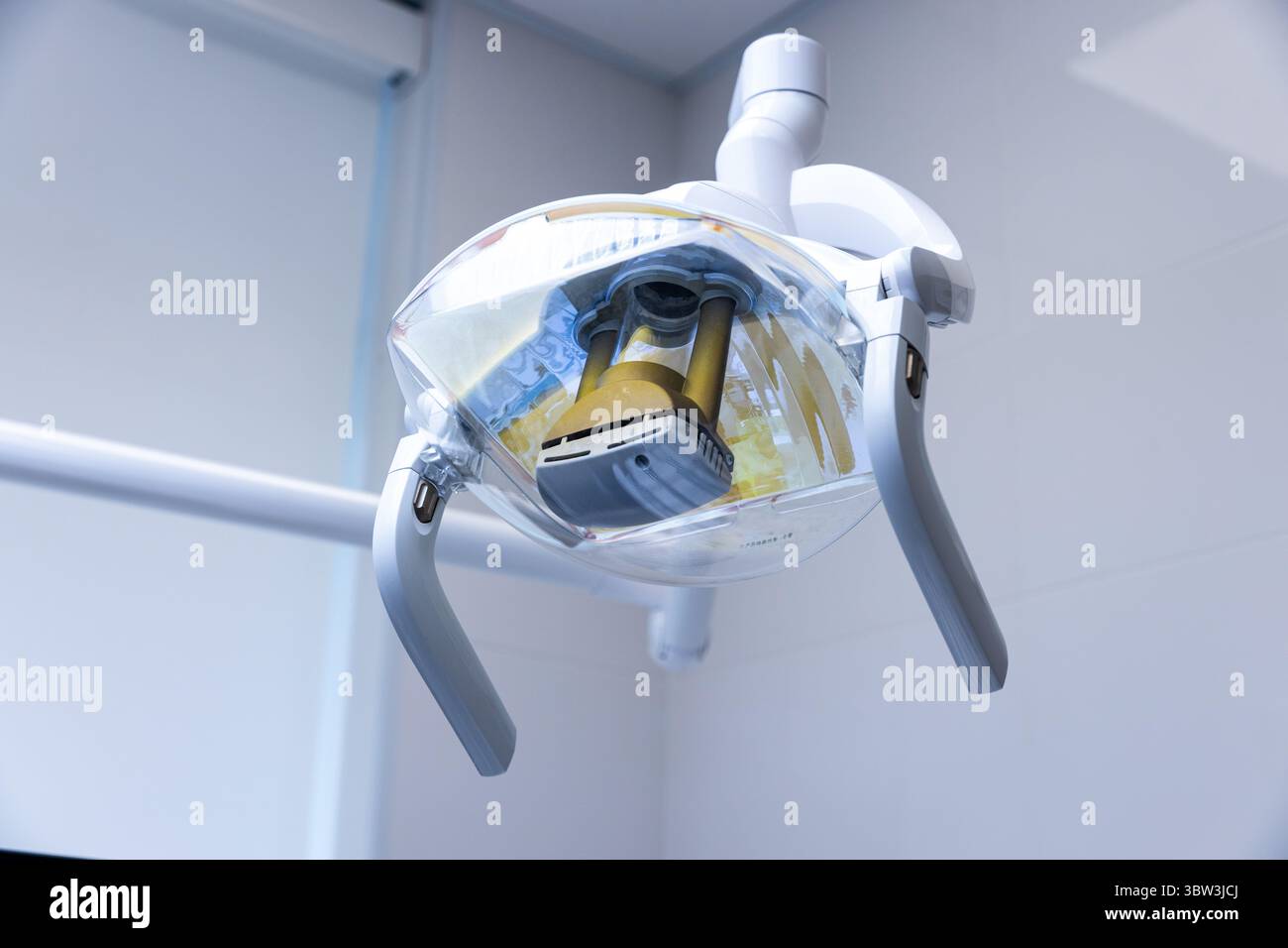 A Modern Dental Ceiling Light Fixture Hanging in a Clinic Room with a ...