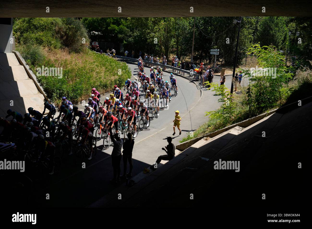 Spectators watch the riders during the eleventh stage of the Tour de ...