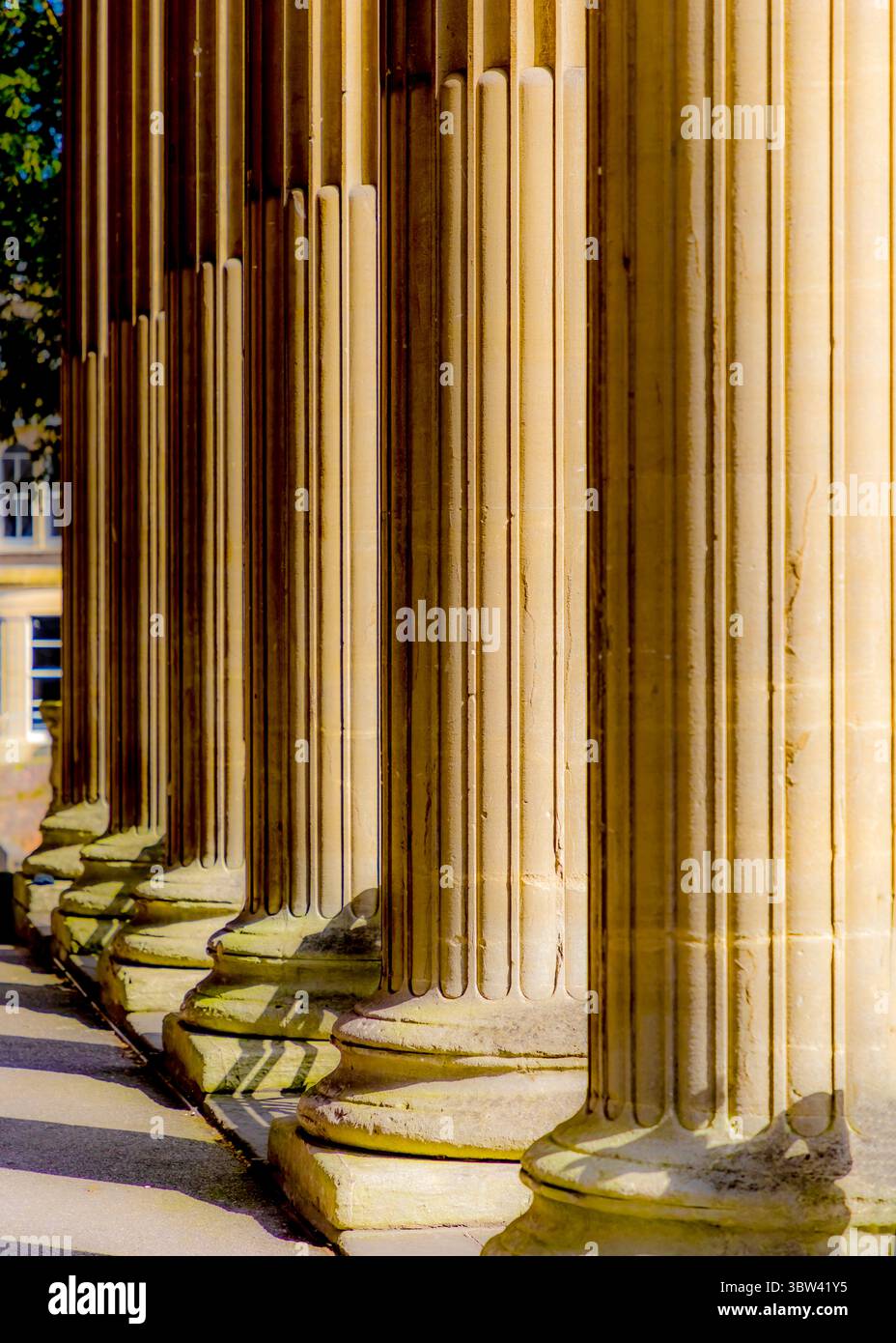 A row of fluted columns in a building's facade Stock Photo - Alamy