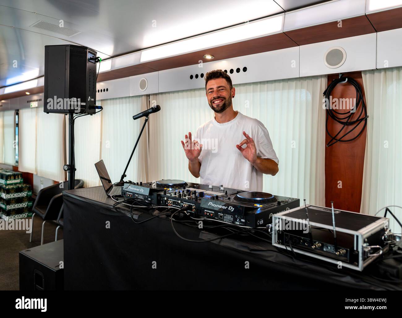 DJ at the mixing desk in the carriage of the special CD Colours express train, which take ...