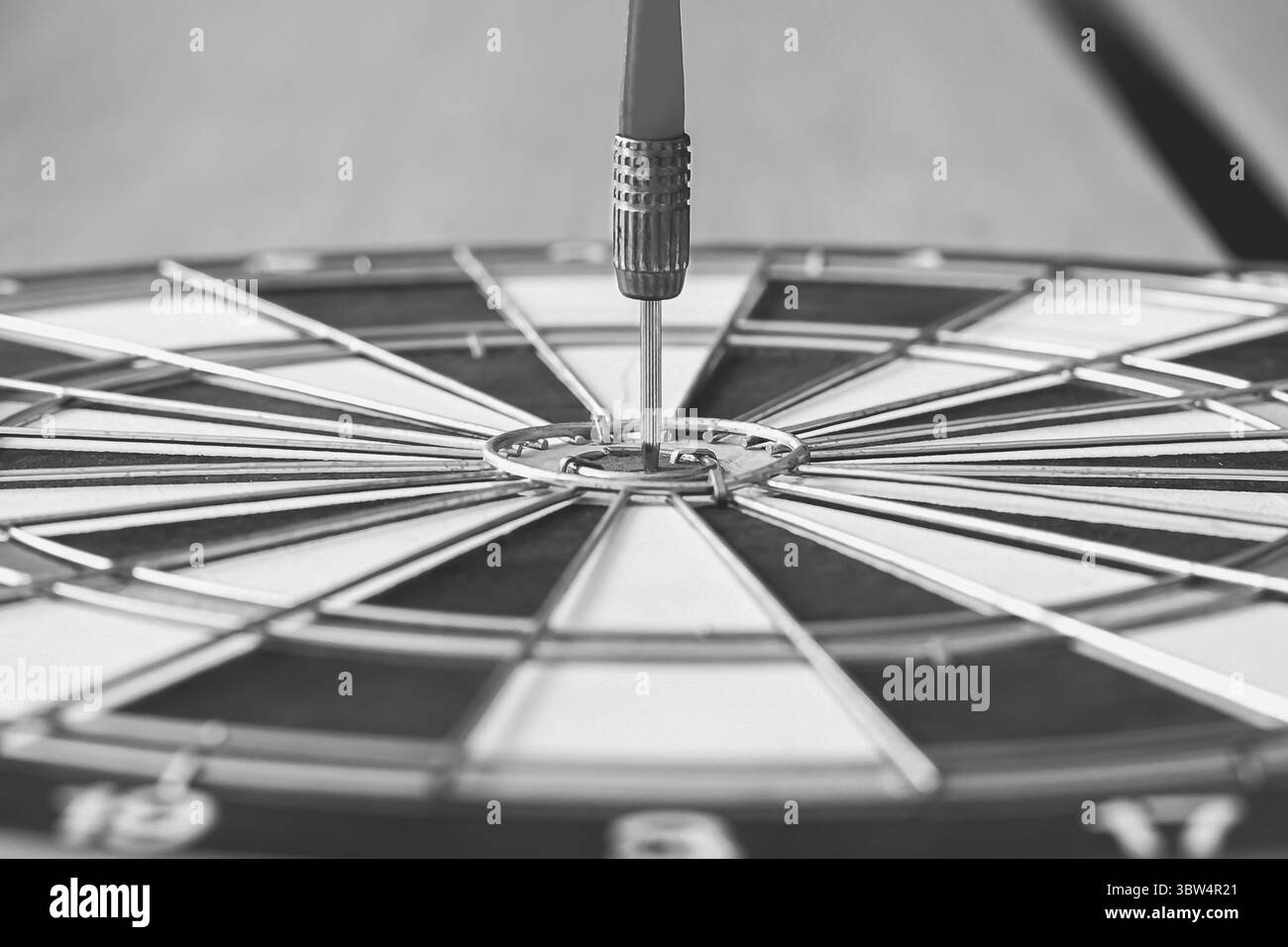 Target dart hitting center Black and White Stock Photos & Images - Alamy