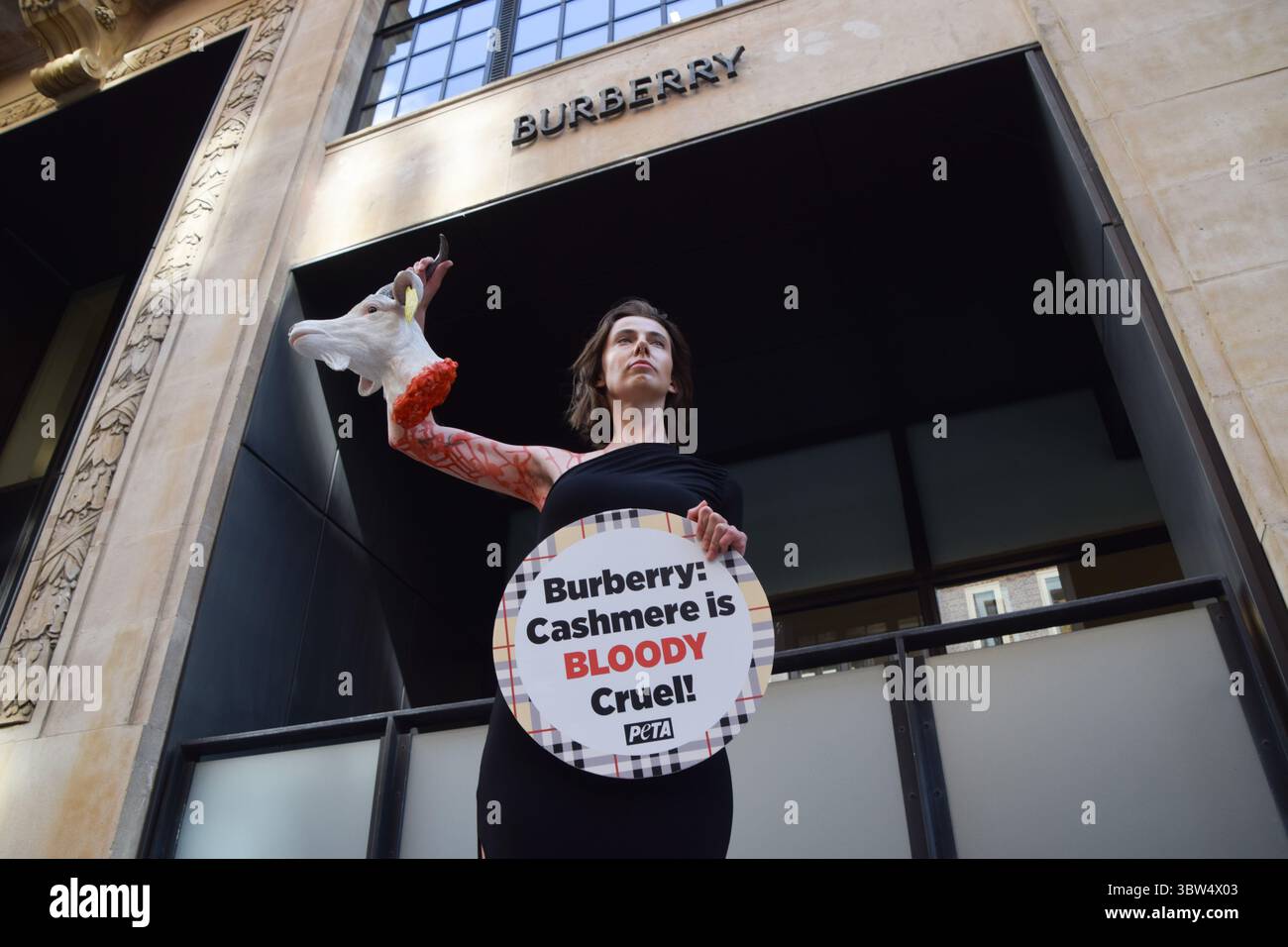London, UK. 16th July 2025. A PETA activist stands with an artificial ...
