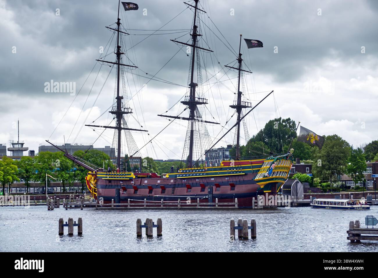 Replica three master ship with flags waving, docked in amsterdam harbor ...