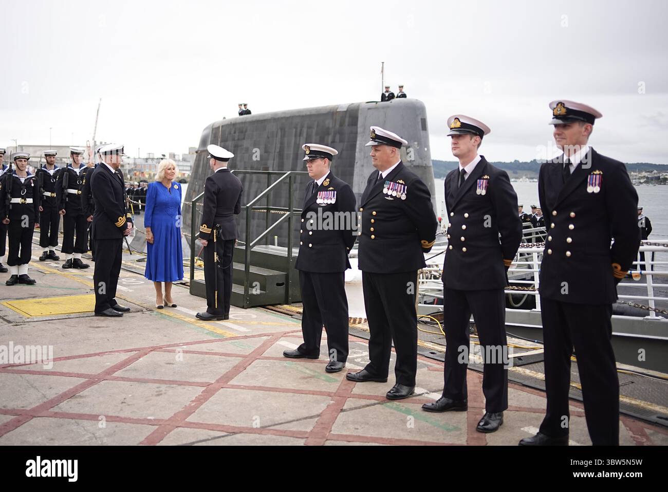 Queen Camilla, Lady Sponsor of the HMS Astute, meeting ships company ...