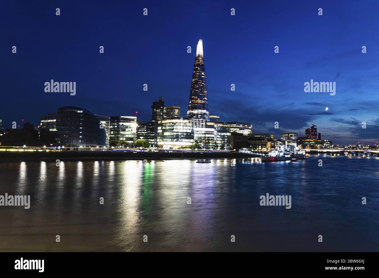 The Shard lights up the London skyline at night, reflecting beautifully ...