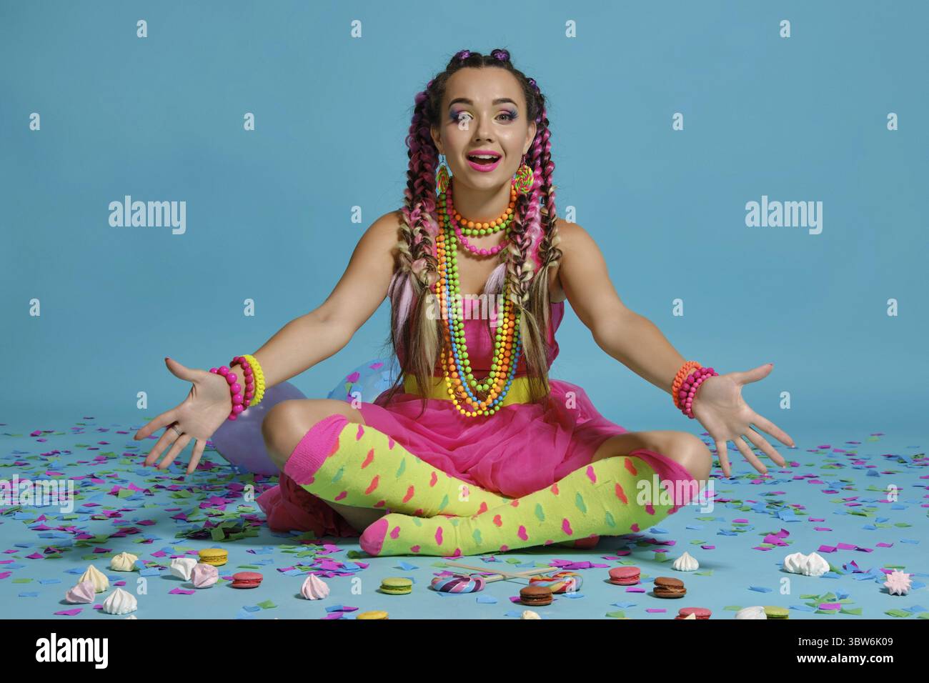 Full length photo of a superb woman with a multi-colored braids ...