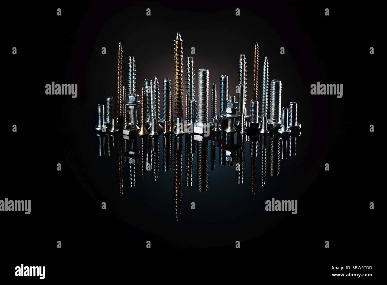 Night city of screws, bolts and nuts with reflection on a black ...